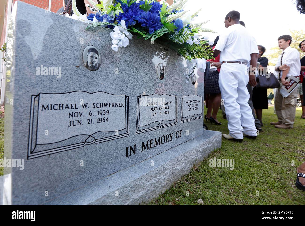FILE - In this June 15, 2014 file photograph, flowers top the memorial ...
