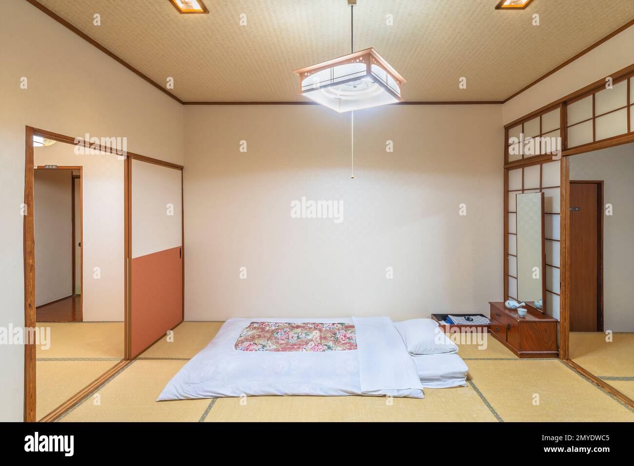 A Typical Traditional Japanese Bedroom Characterized By Tatami Mats