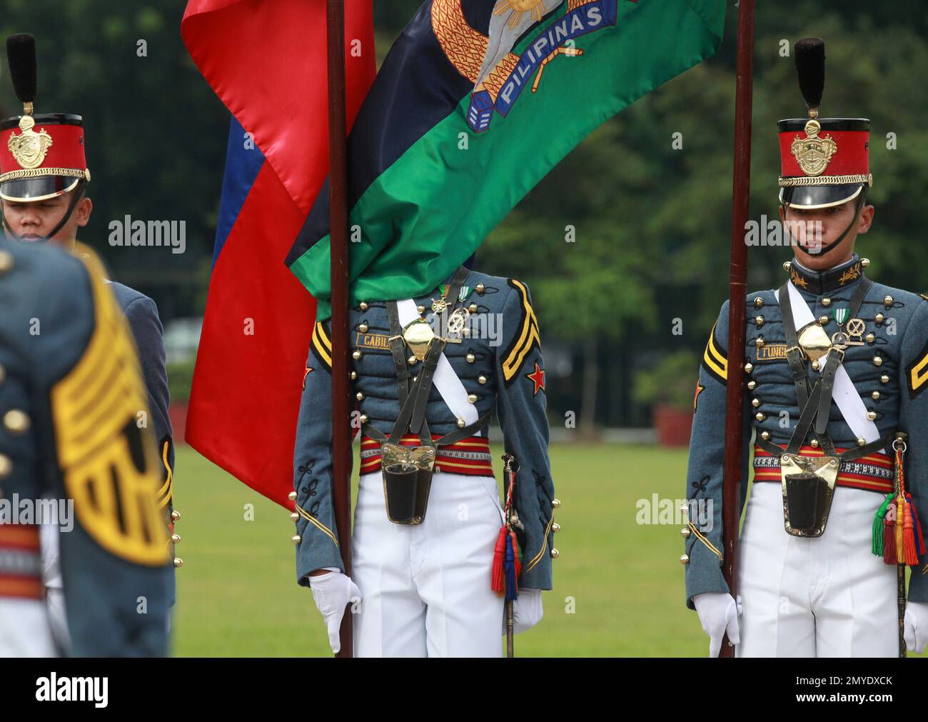 A flag of the Philippine Armed Forces covers the face of a cadet of the ...