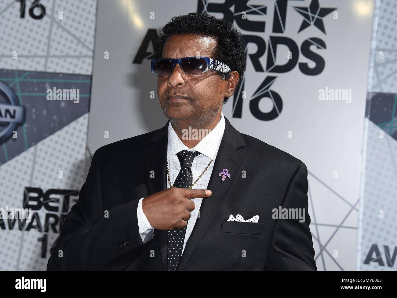 Alfred Jackson points to a pin in honor of his brother, Prince, at the ...