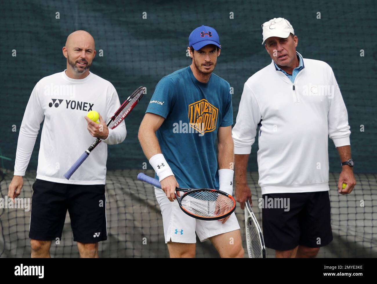 Andy Murray of Britain speaks with coaches Ivan Lendl, right, and Jamie ...