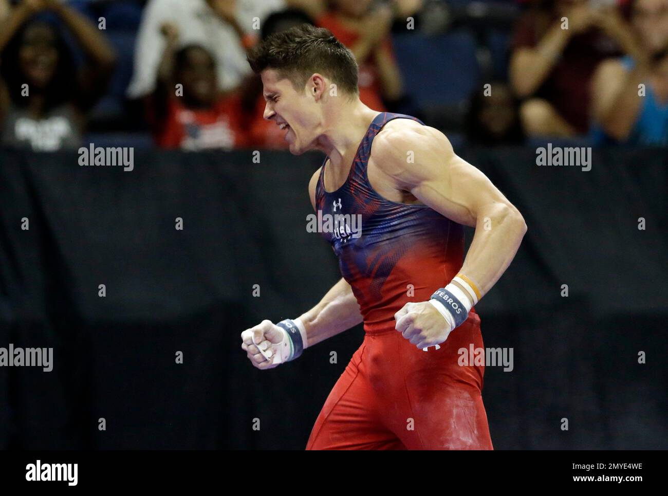Chris Brooks celebrates after competing on the high bar during the U.S ...