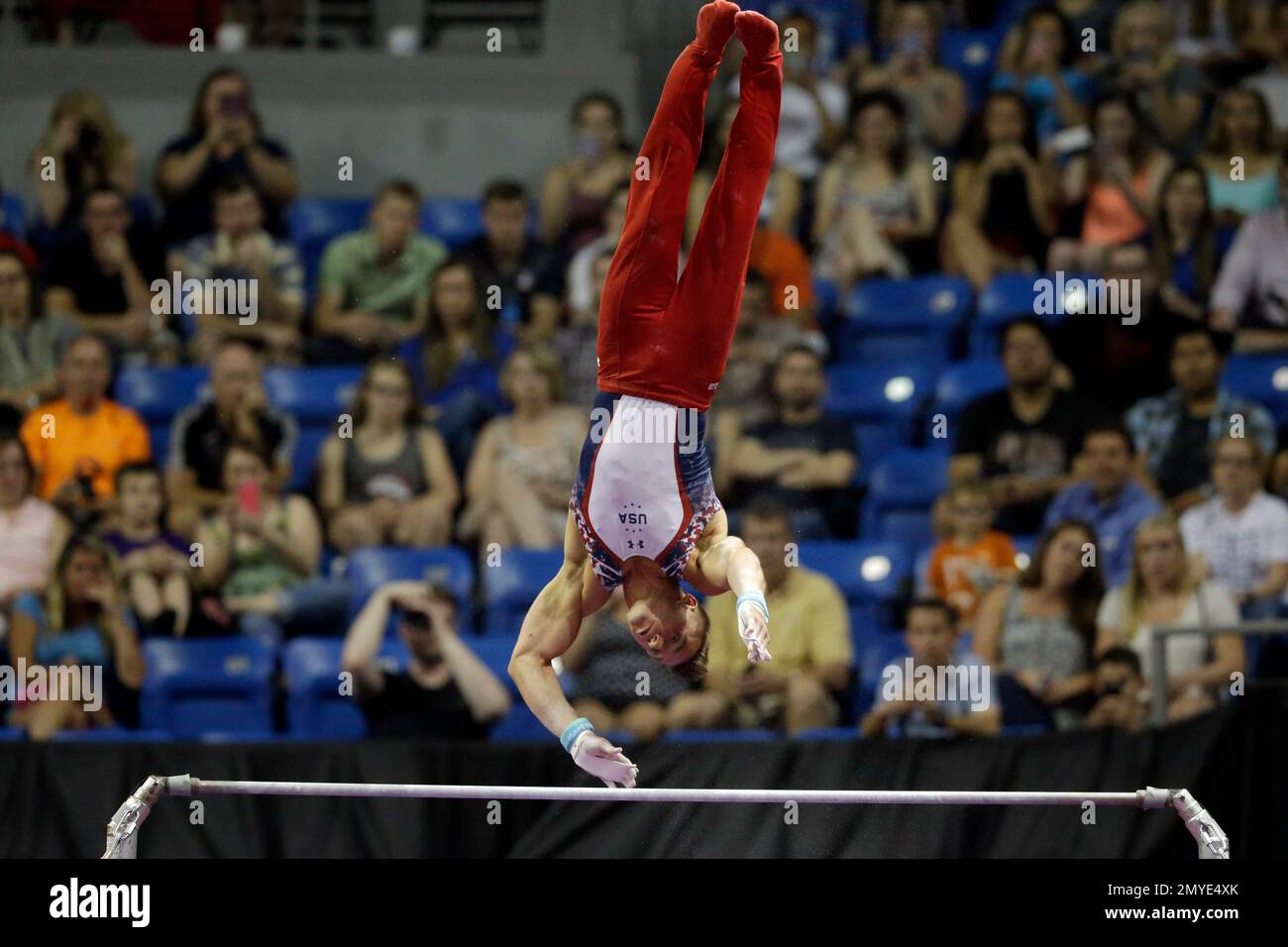 Sam Mikulak competes on the high bar during the U.S. men's Olympic ...