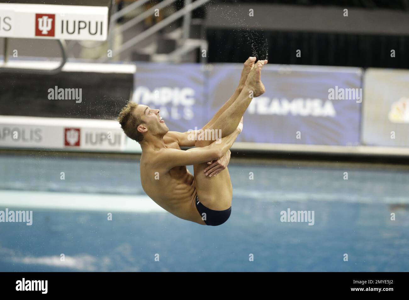 Kristian Ipsen performs a dive during the men's 3-meter springboard ...