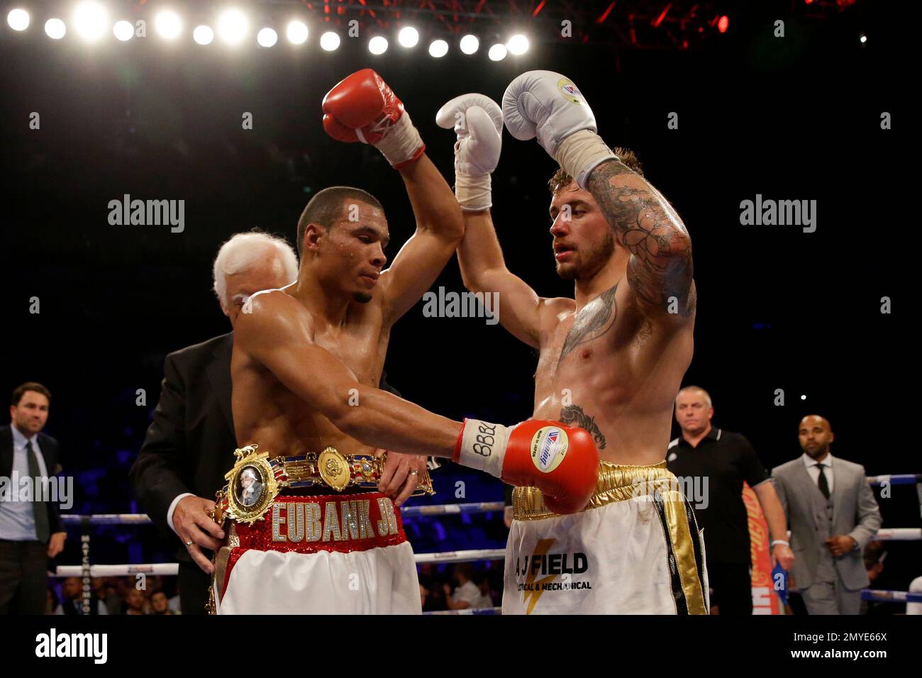 British boxer Chris Eubank Junior, left, receives the belt after ...