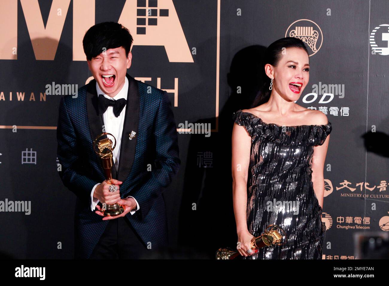 Taiwanese singer Julia Peng and Singapore singer JJ Lin smile and hold ...