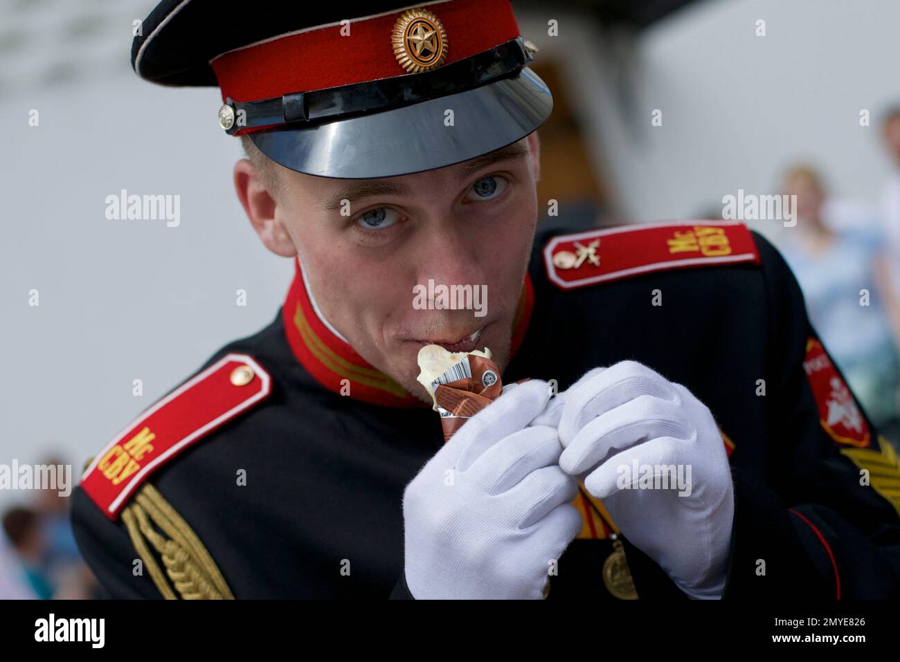 A Russian cadet enjoys an ice-cream after a graduation ceremony in ...