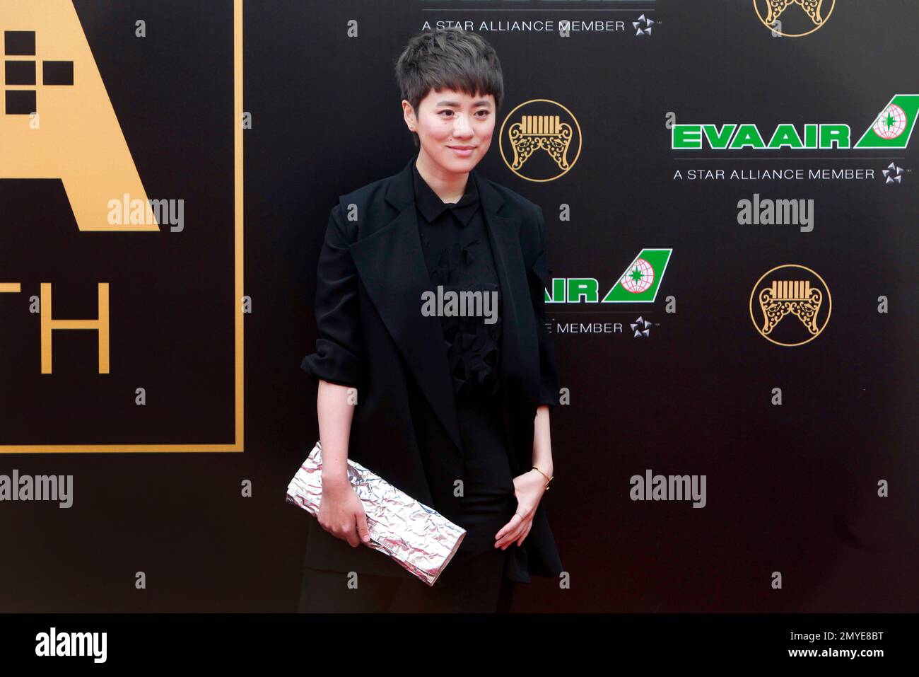 Hong Kong singer Yoyo Sham smiles as she arrives at the 27th Golden ...