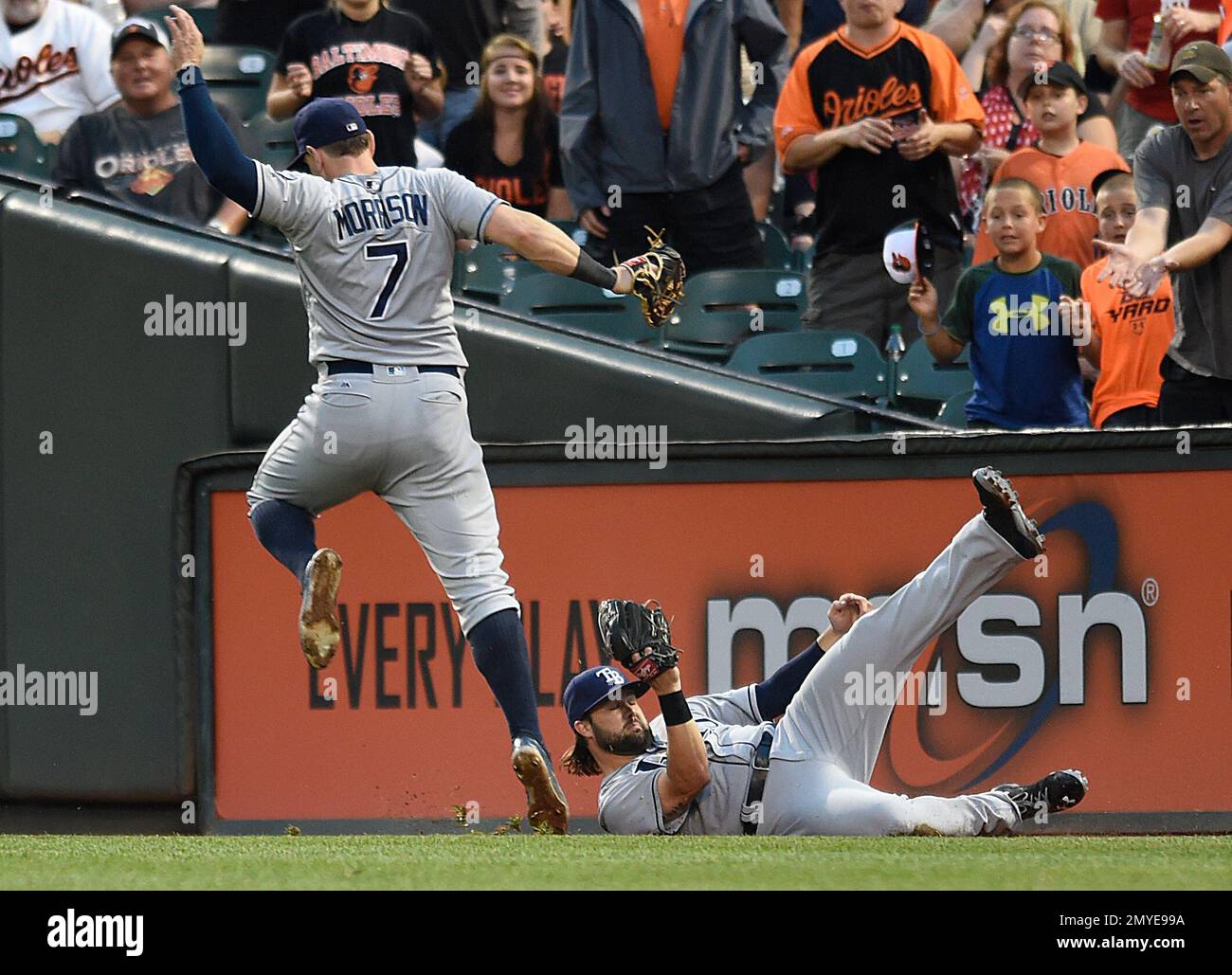 Tampa Bay Rays right fielder Jaff Decker, right, makes a sliding catch ...