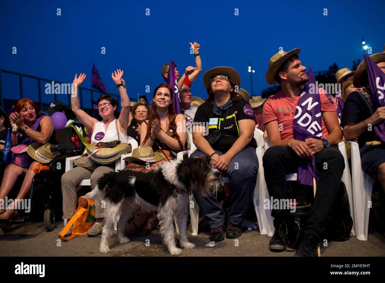 Spain's Unidos Podemos coalition party supporters listen to speeches ...