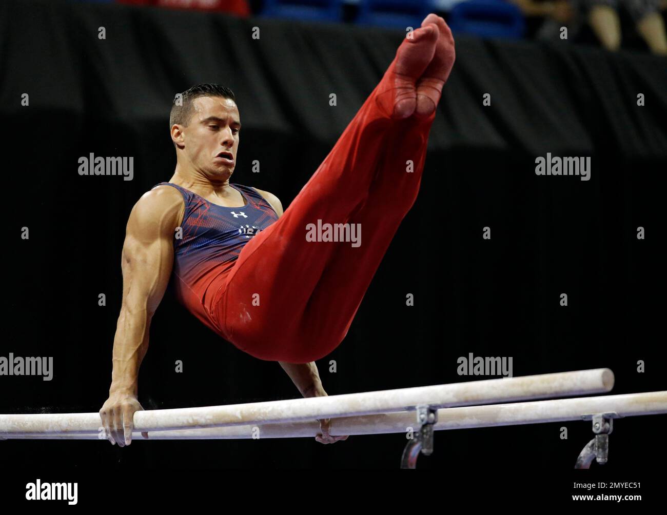 Jacob Dalton competes on the parallel bars during the U.S. men's ...