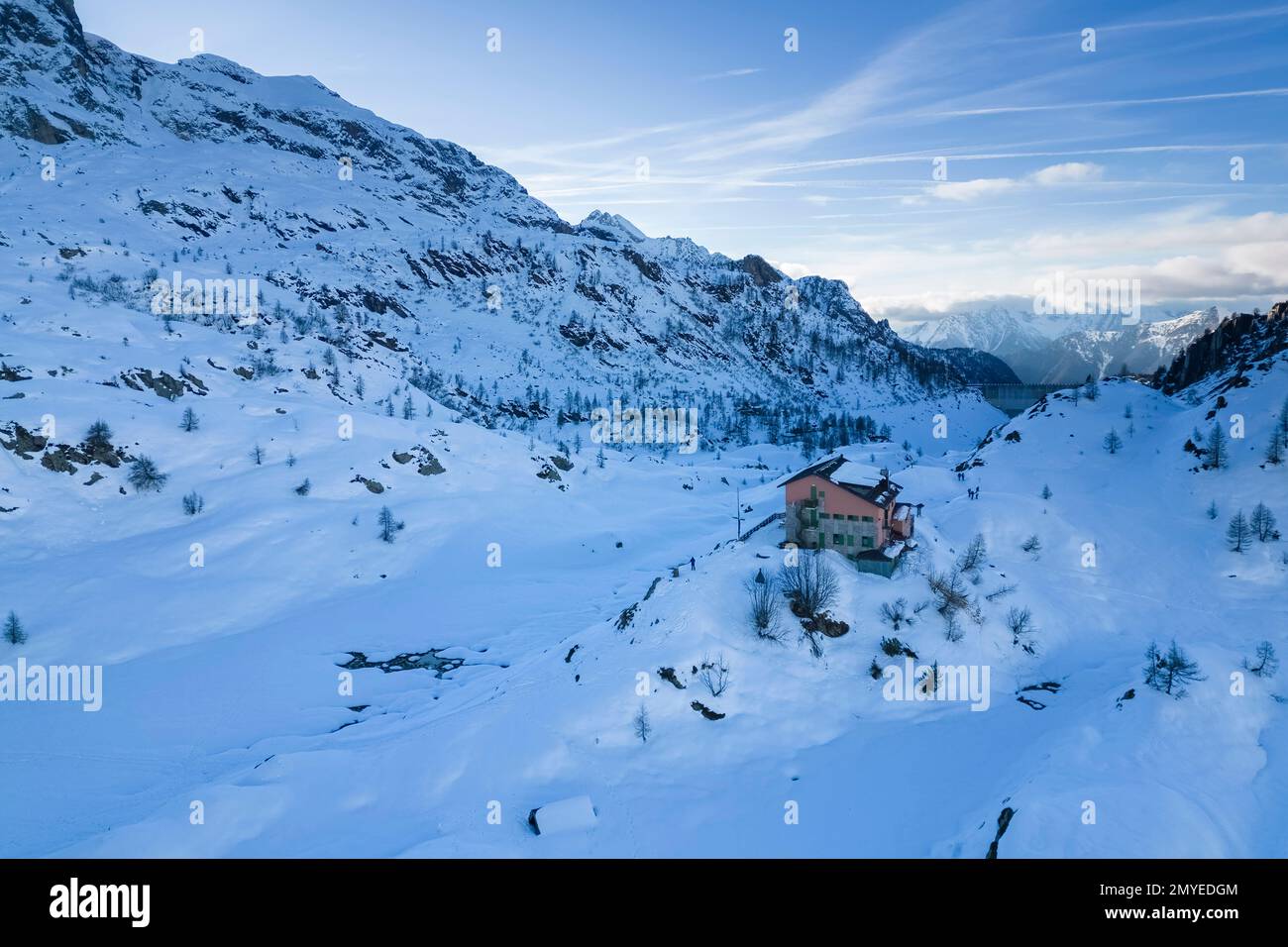 View of the Rifugio Calvi and Fregabolgia lake in winter. Carona, Val ...