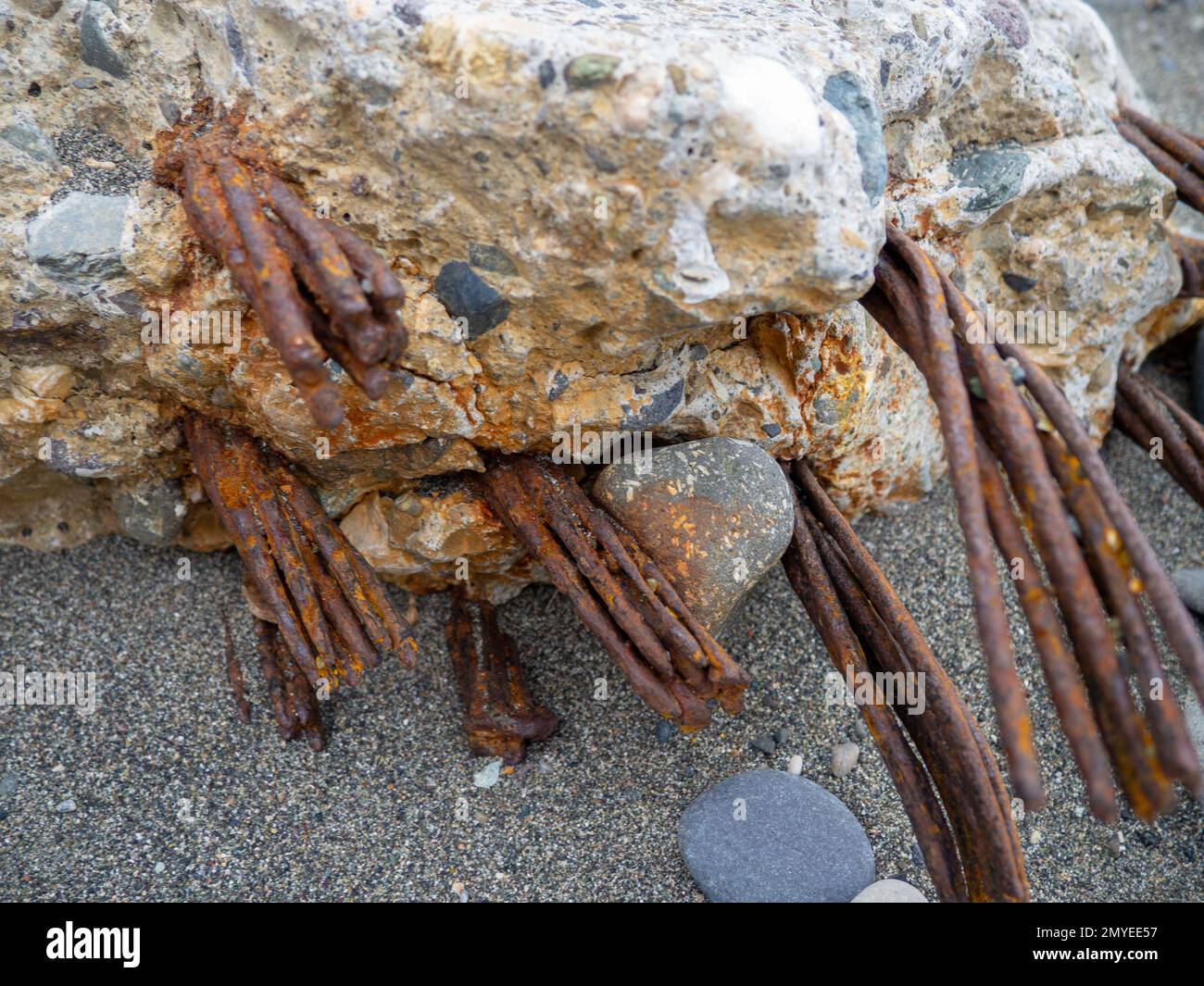 Reinforced concrete. Destroyed building material. Rusty iron ...
