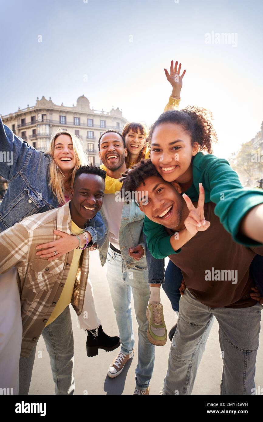 Vertical selfie of A group of cheerful students college friends travel ...