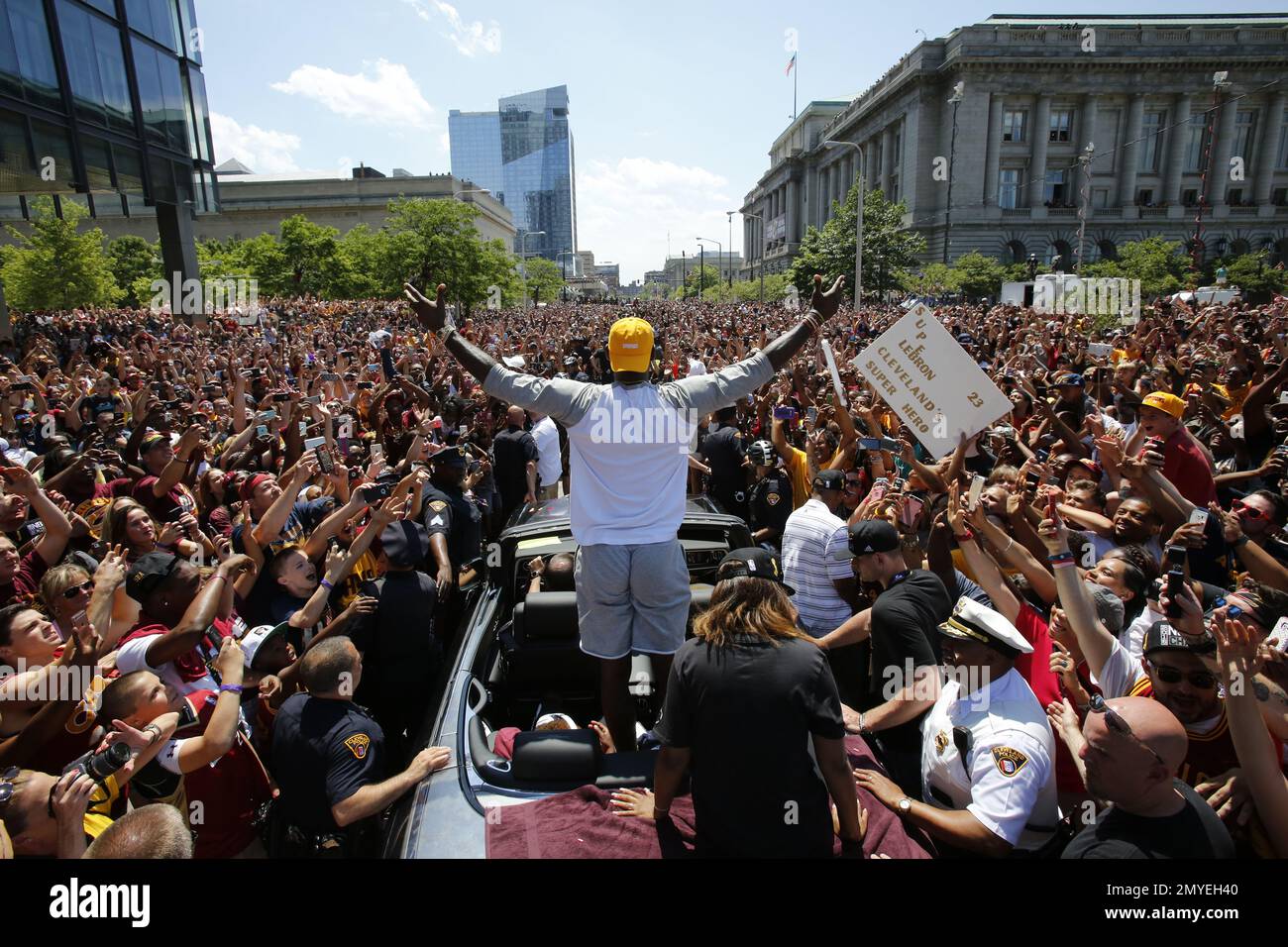 Cleveland Cavaliers' LeBron James, center, stands in the back of a ...