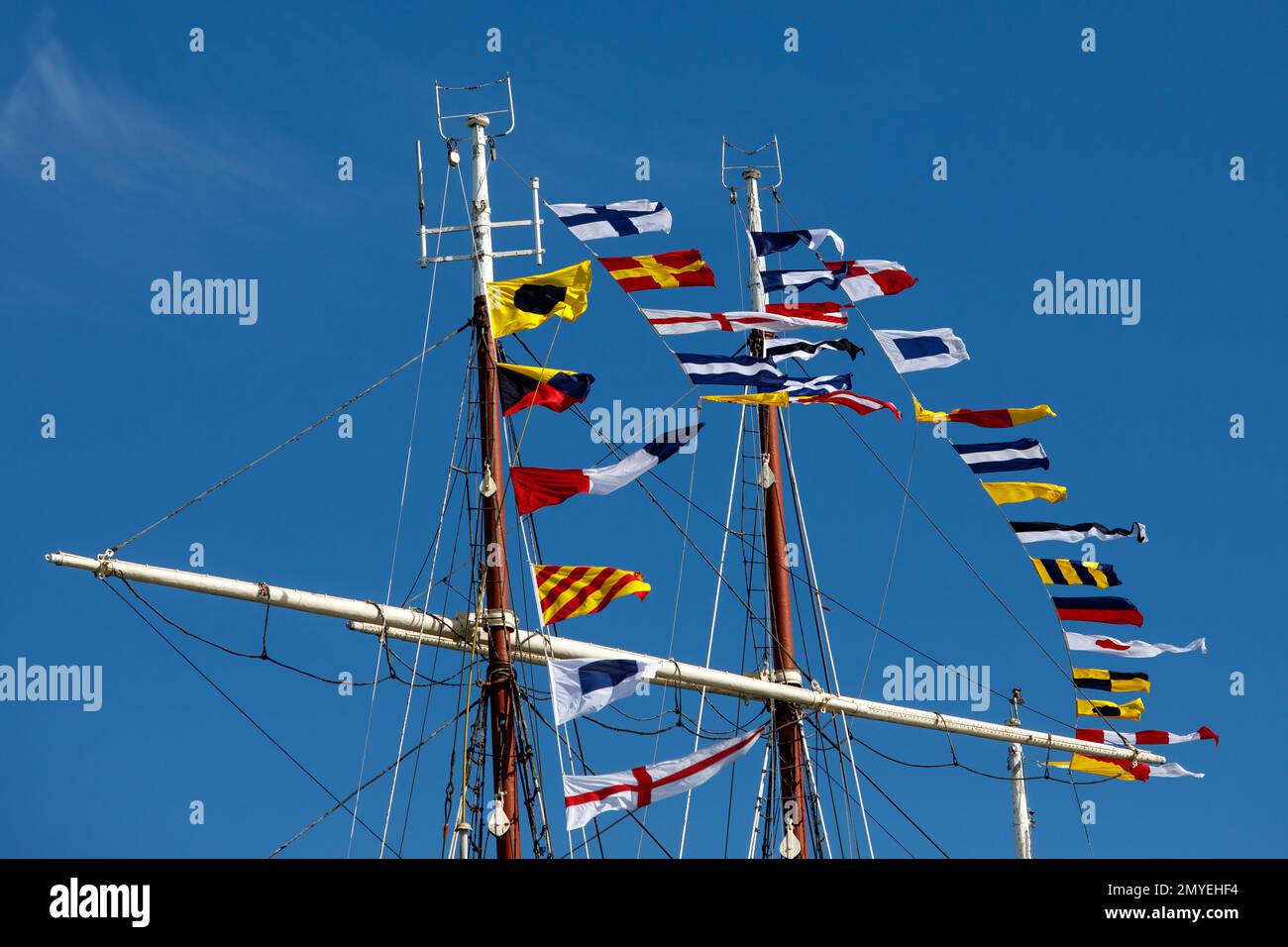 International maritime signal flags on a flagpole and masts on a ...