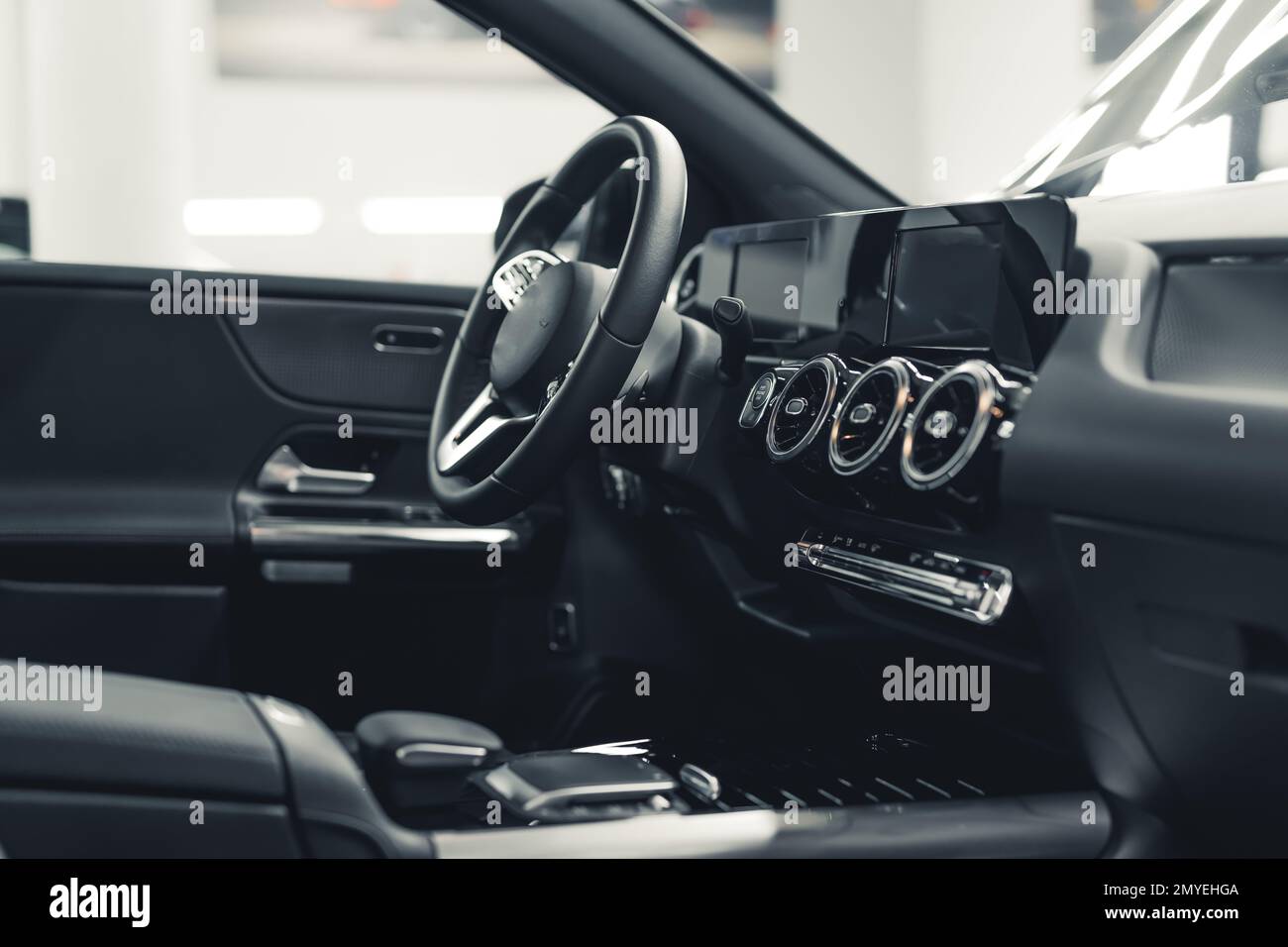 Modern sports car inside. Black interior with leather and plastic ...