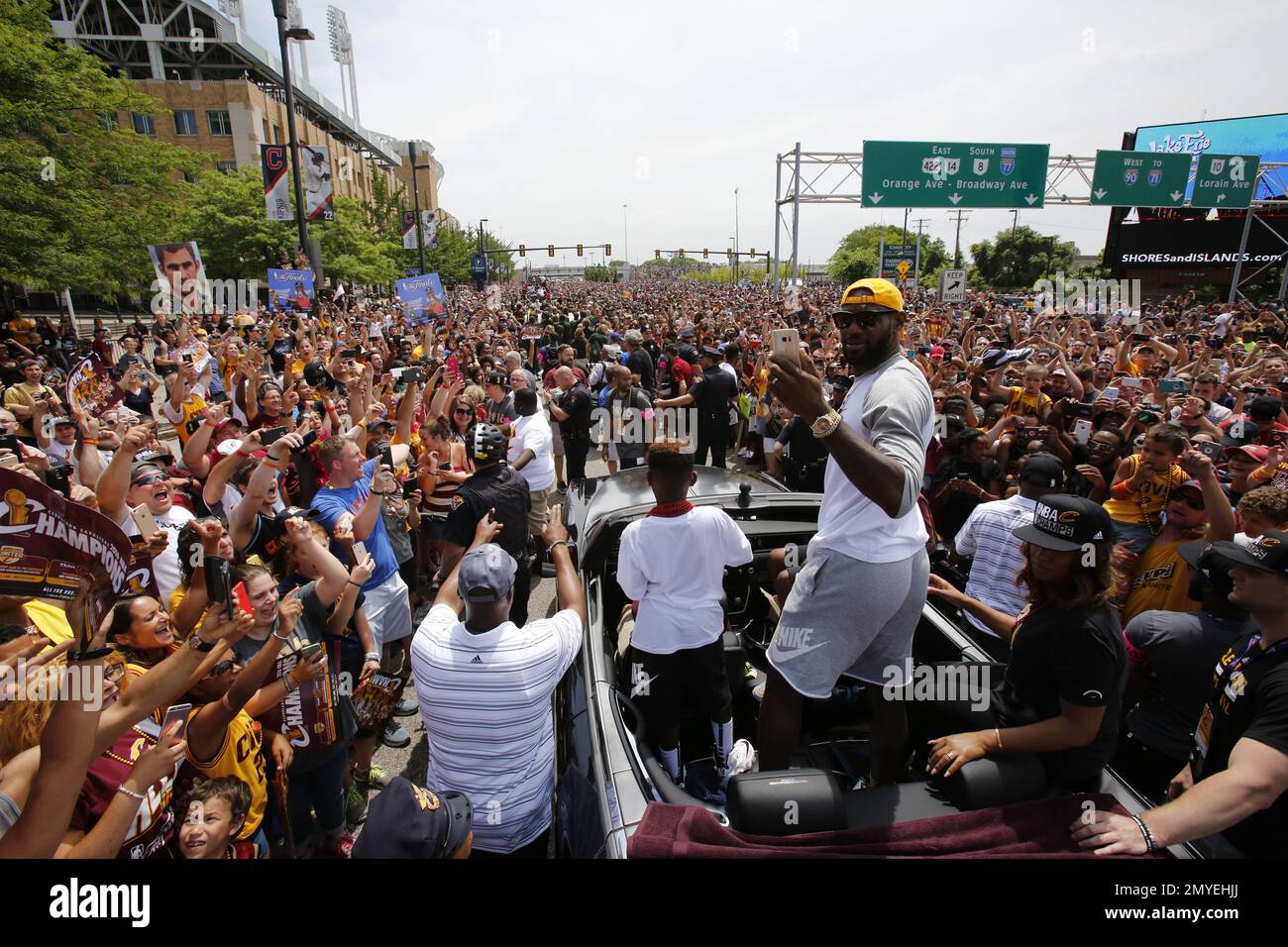 Cleveland Cavaliers' LeBron James and his family ride in the back of a ...