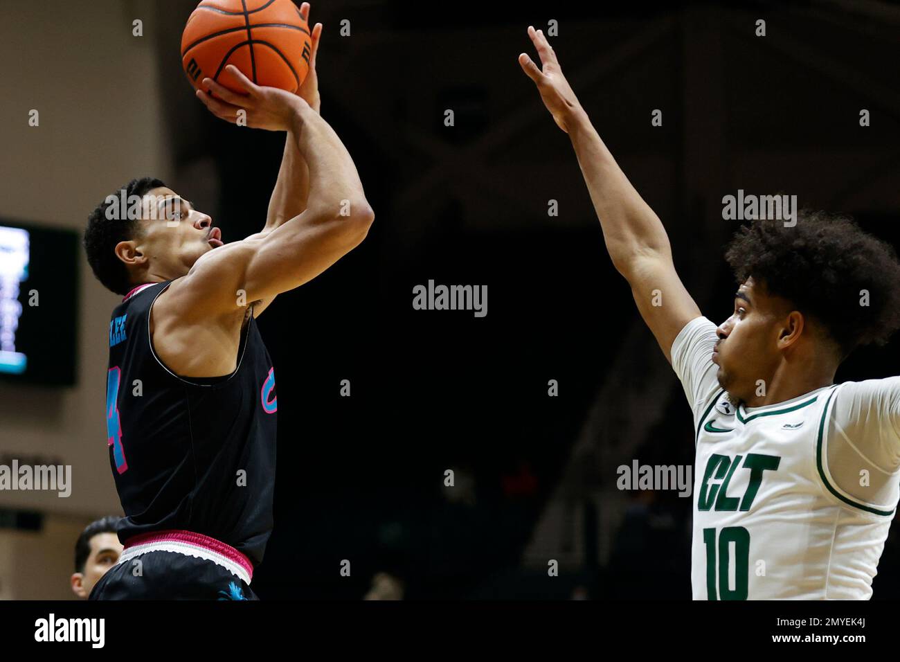 Florida Atlantic guard Bryan Greenlee, left, shoots against Charlotte ...