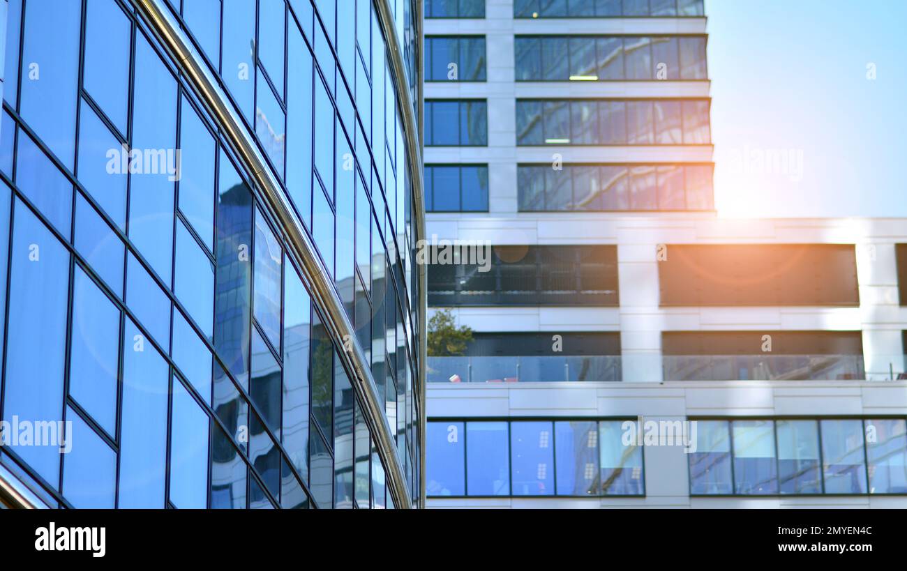 Glass building with transparent facade of the building and blue sky ...