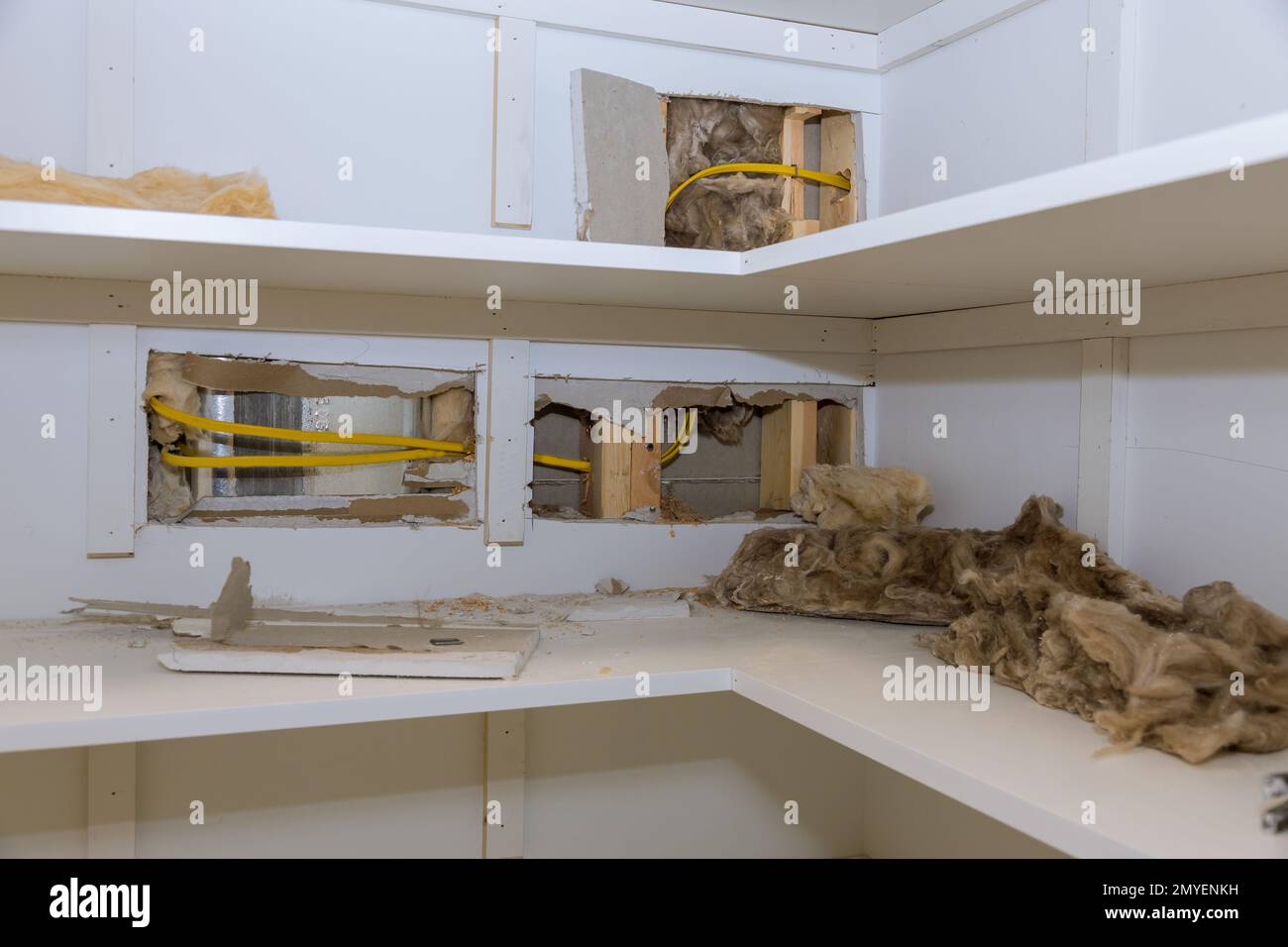 Installation of an laying new cable to interior wall in room closet ...