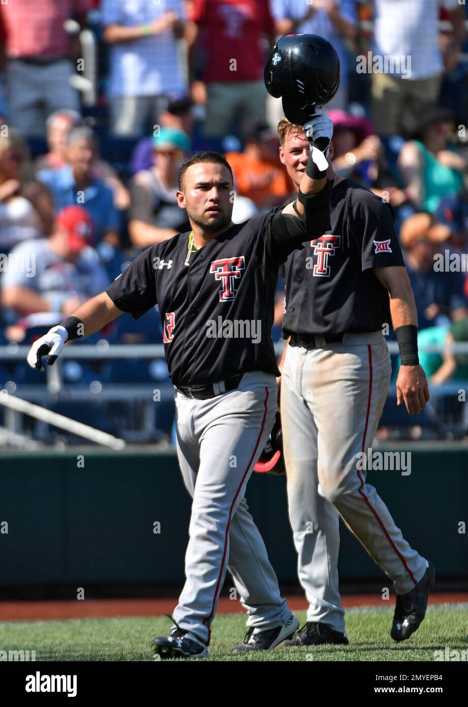 Texas Tech's Eric Gutierrez (12) gestures to the crowd after hitting a ...