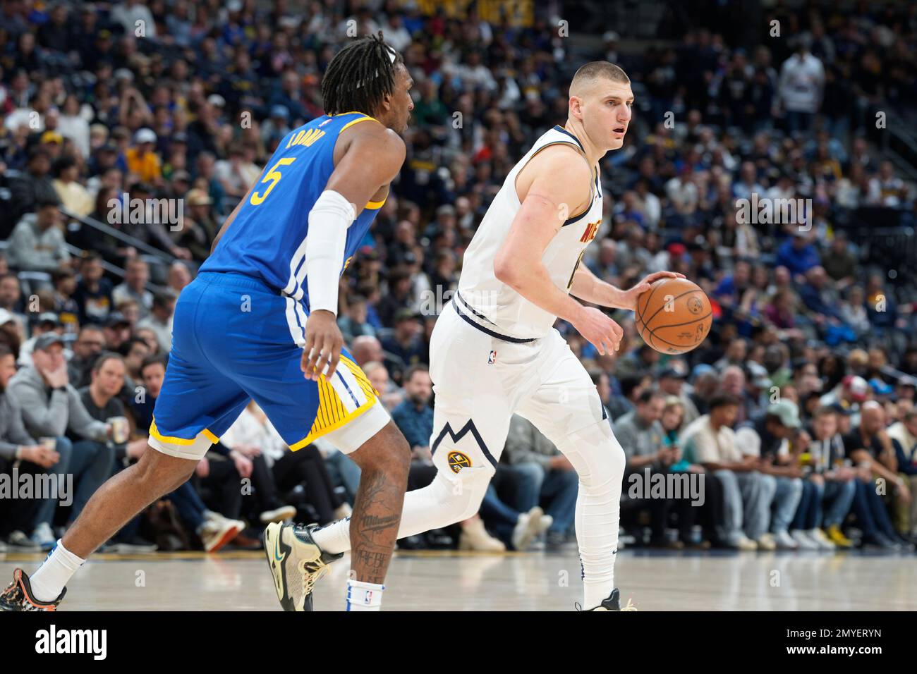 Denver Nuggets center Nikola Jokic (15) and Golden State Warriors ...