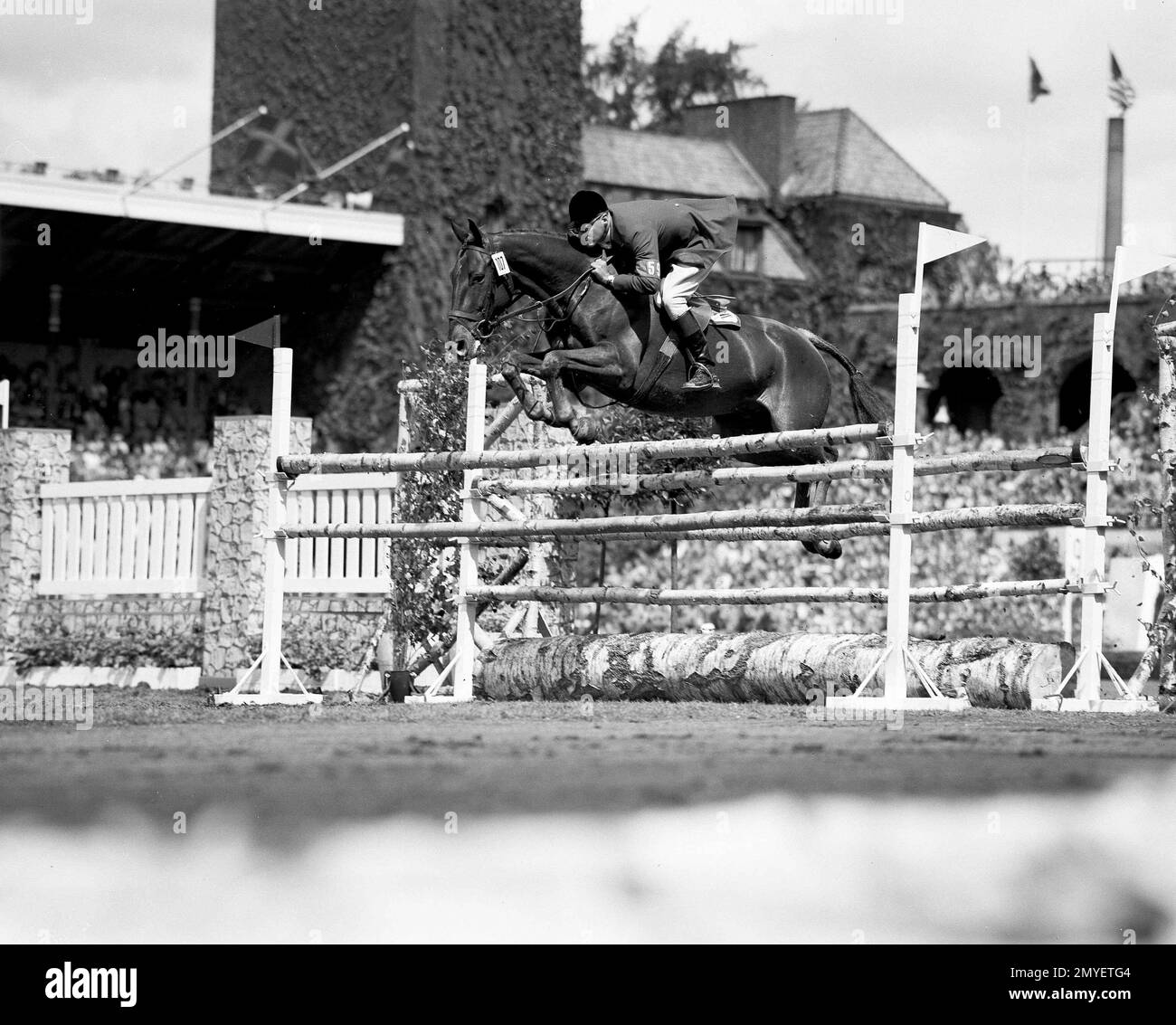 Frank Chapot of the United States clears a hurdle on his horse Bel Air ...