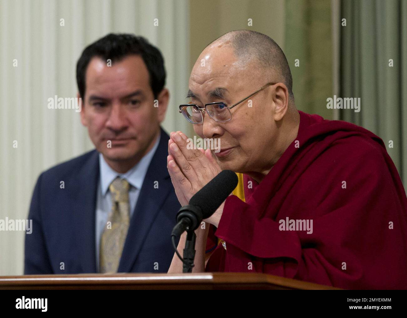 The Dalai Lama, right, bows before speaking at a joint session of the ...