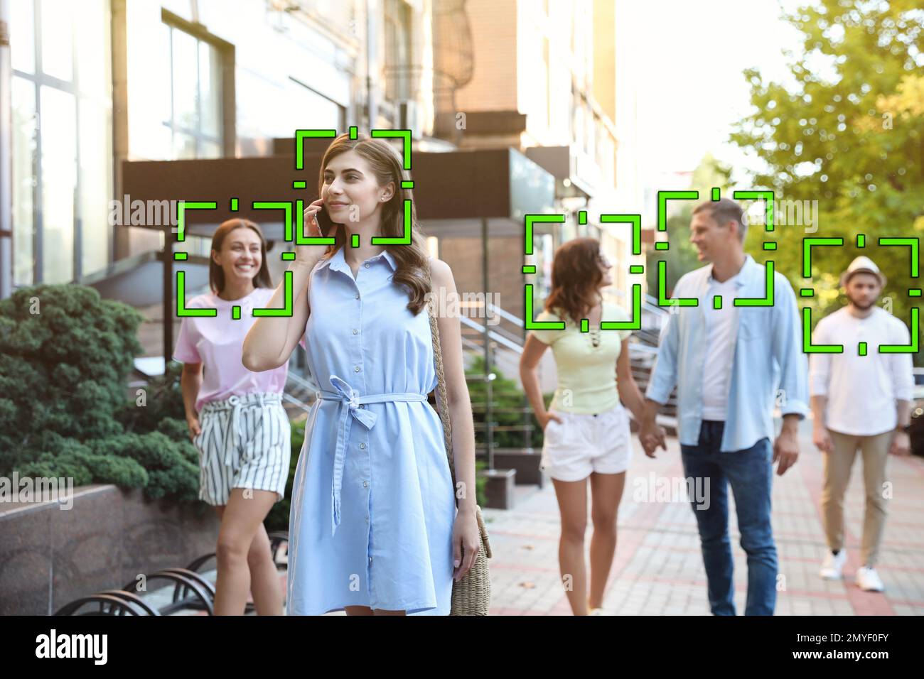 Facial recognition system identifying people on city street Stock Photo ...