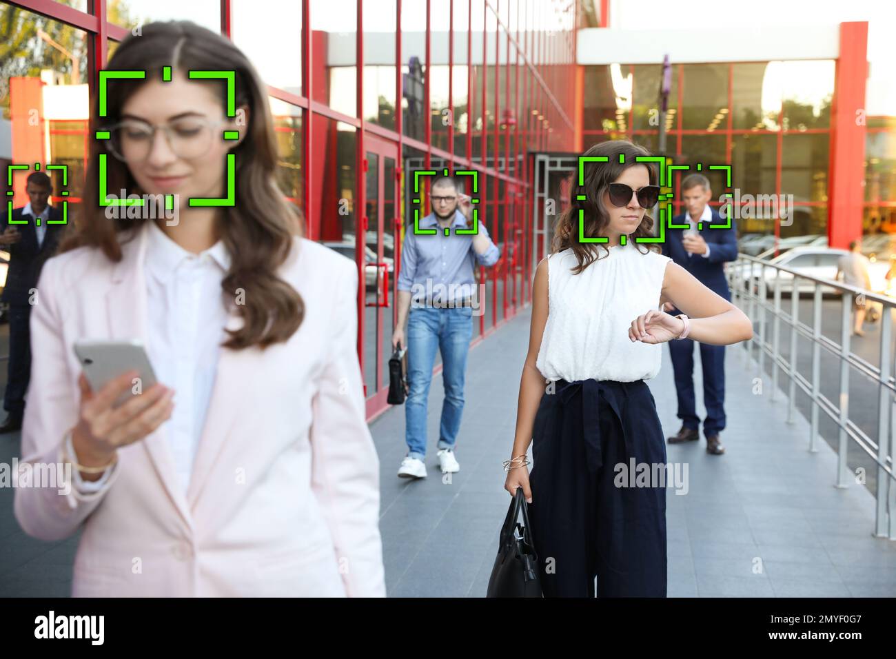 Facial recognition system identifying people on city street Stock Photo ...