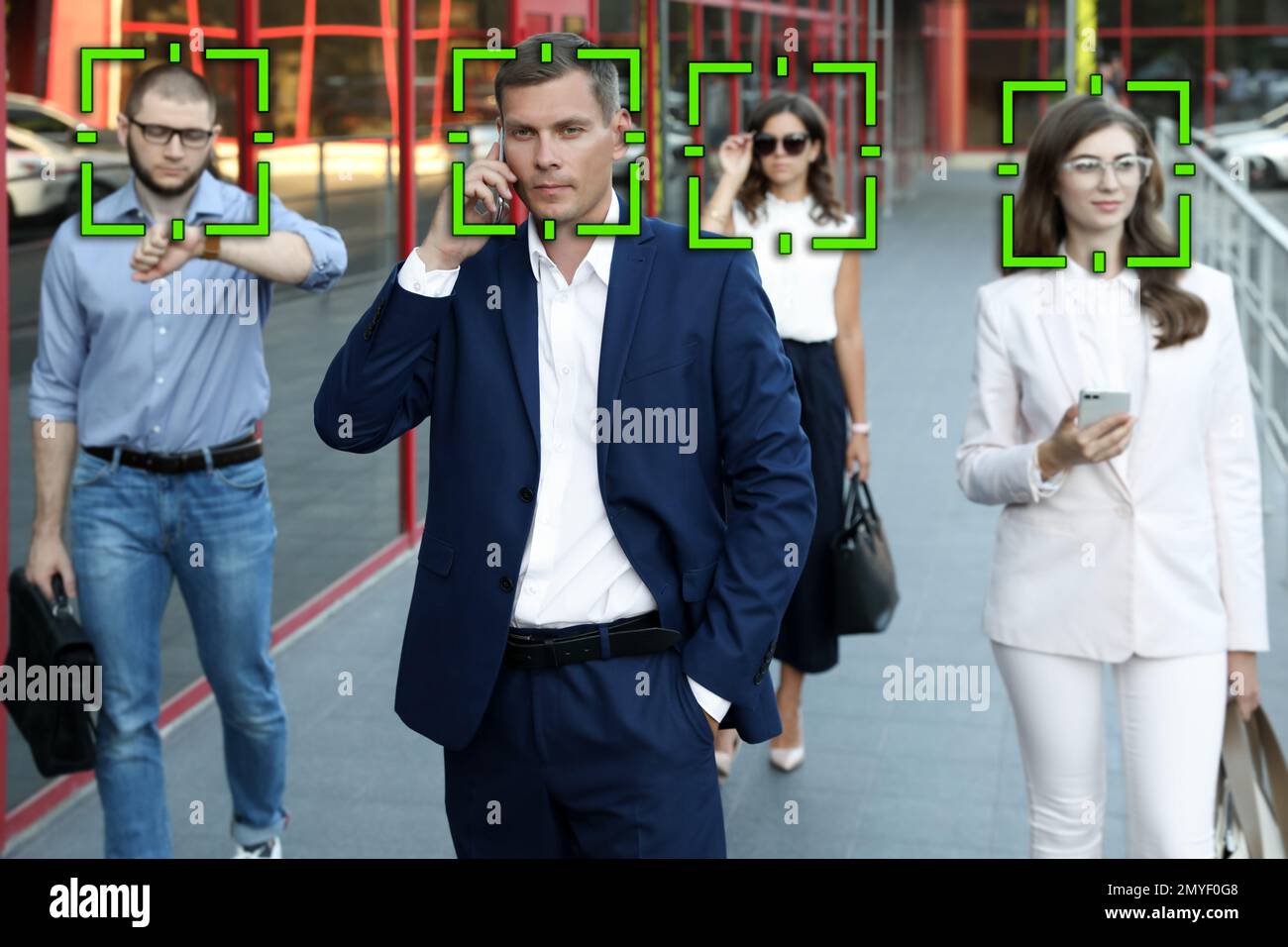 Facial recognition system identifying people on city street Stock Photo ...