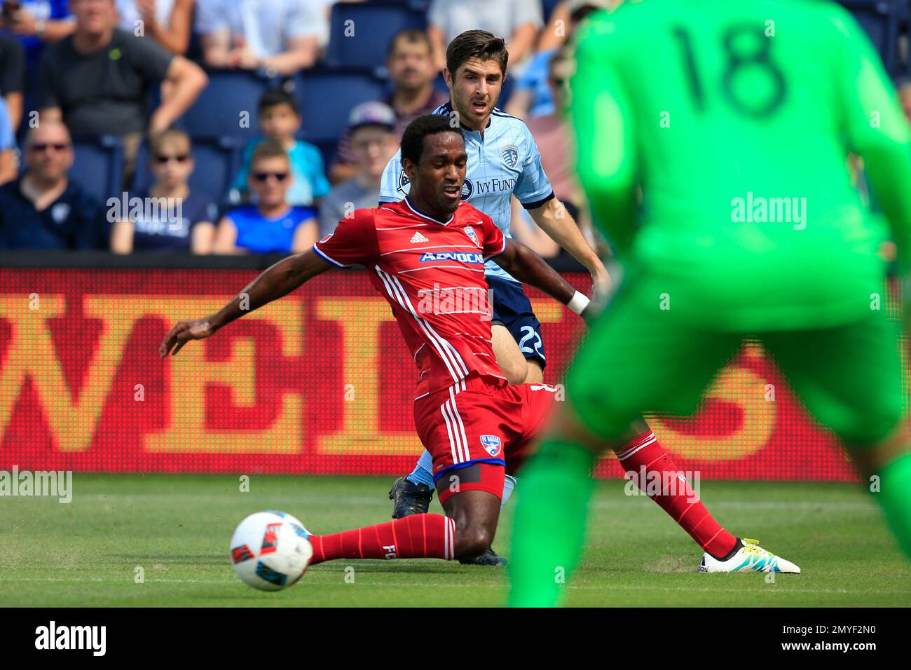 FC Dallas forward Atiba Harris (14) and Sporting Kansas City midfielder ...