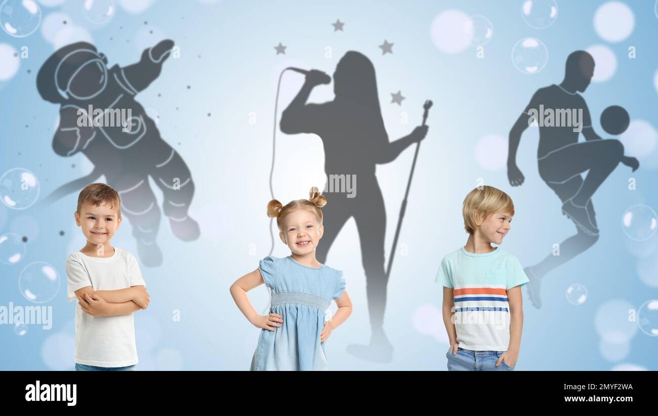 Childhood dreams. Little kids against silhouettes of spaceman, singer ...