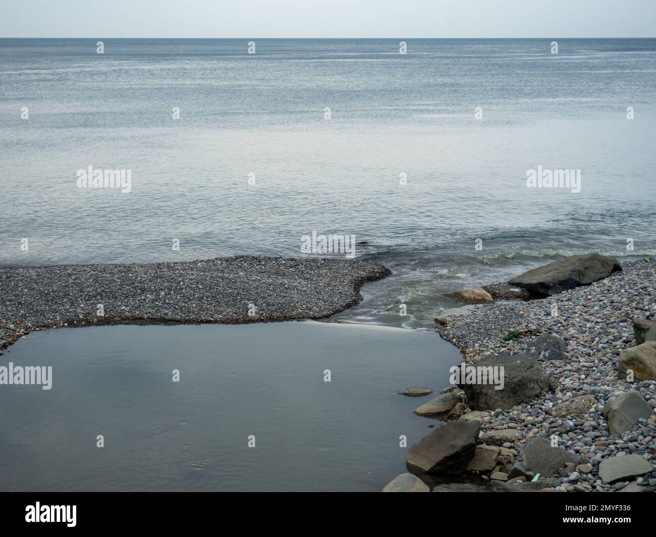 The place where a small river flows into the sea. Winter on the Black ...