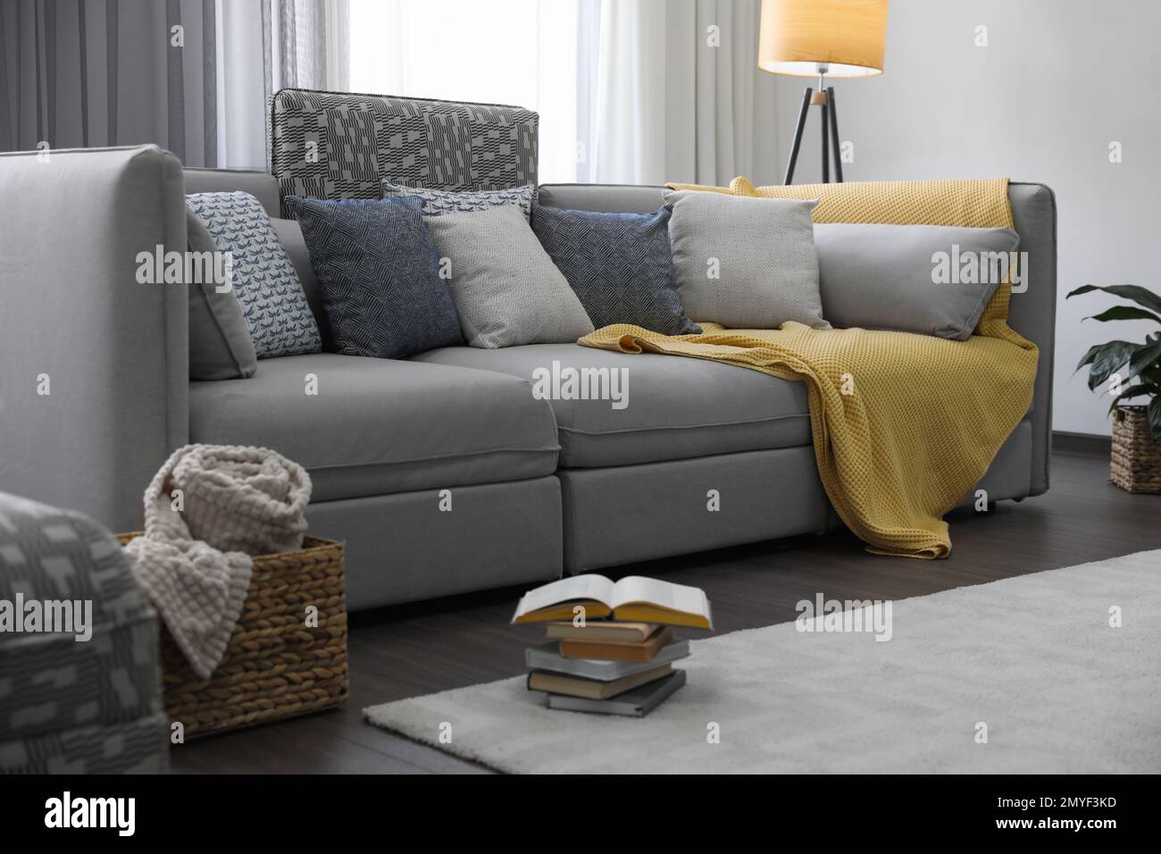 Elegant living room with comfortable sofa near window. Interior design ...