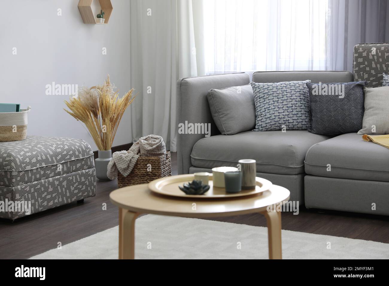 Elegant living room with comfortable sofa near window. Interior design ...