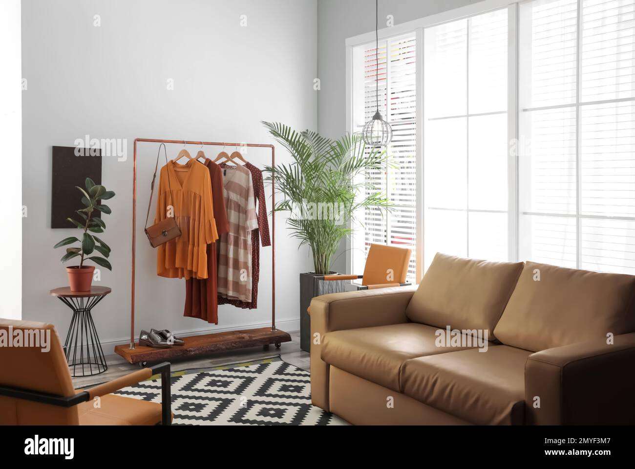 Modern living room interior with stylish leather sofa Stock Photo - Alamy