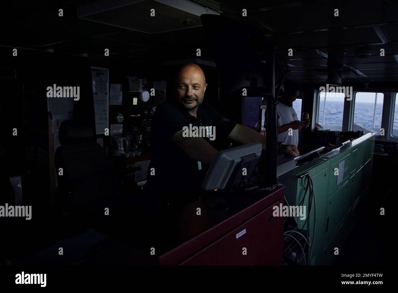 Captain Alex Moroz works on the bridge of the "Aquarius" on Sunday June ...