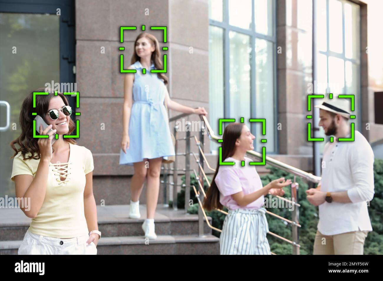 Facial recognition system identifying people on city street Stock Photo ...