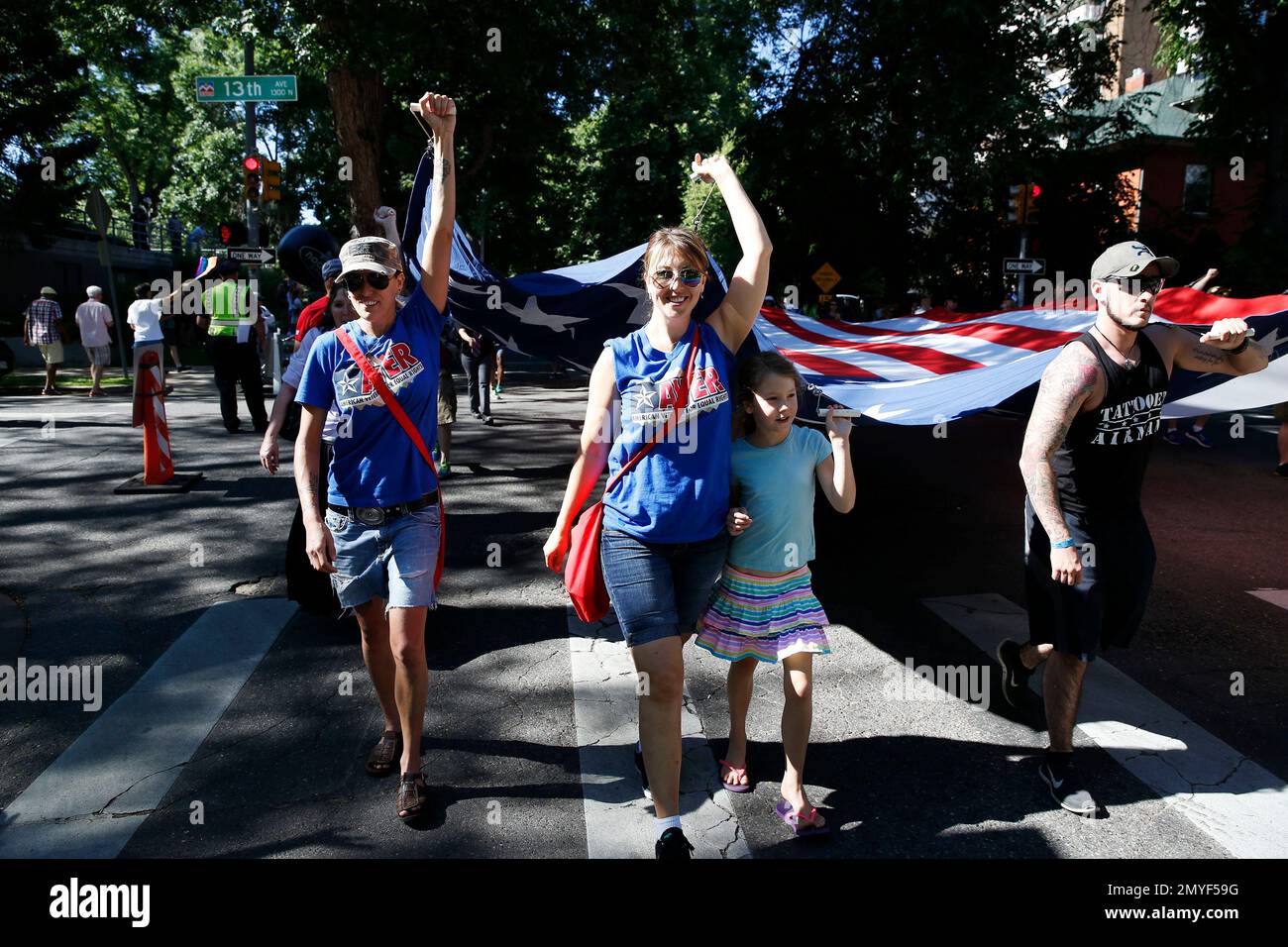 U.S. Army veteran Sarah Alder, left, her partner Joyce McCall, second from left, and their ...