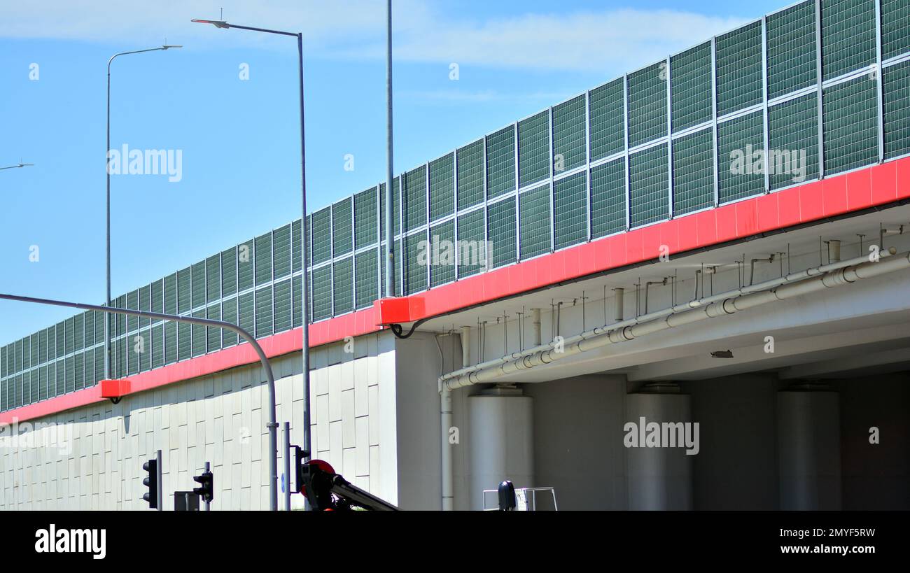 Safety barriers on the highway. Anodized safety steel barrier on ...