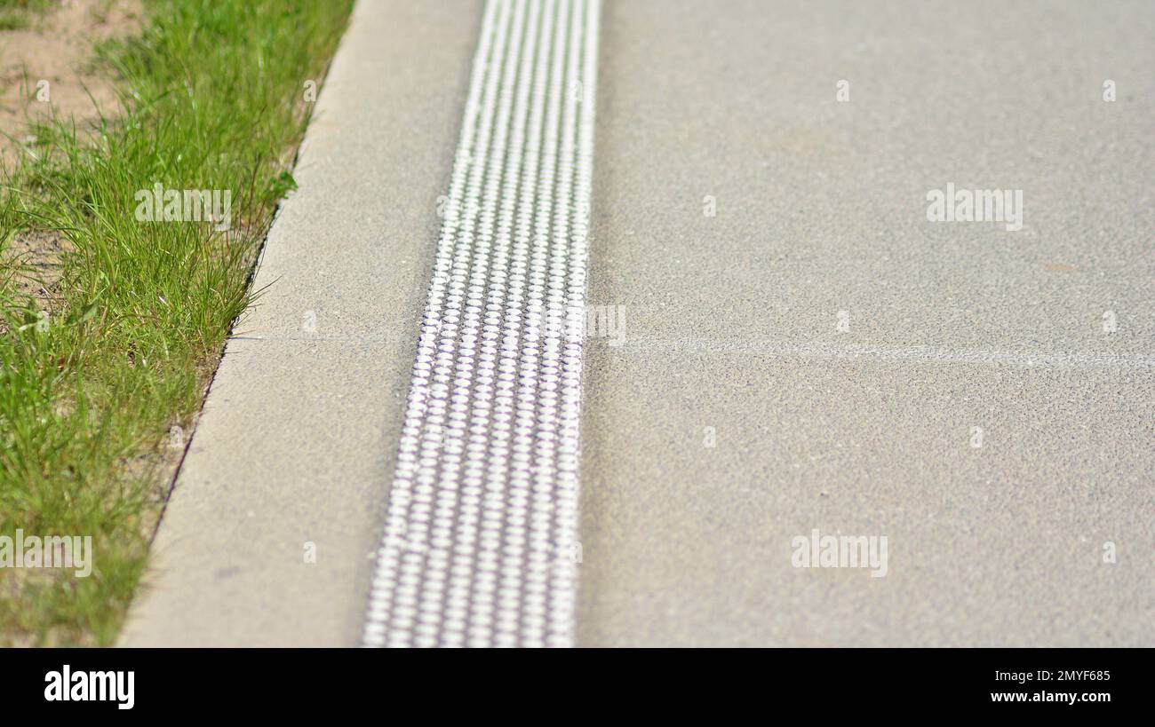 Straight modern concrete motorway with bright road marking ...