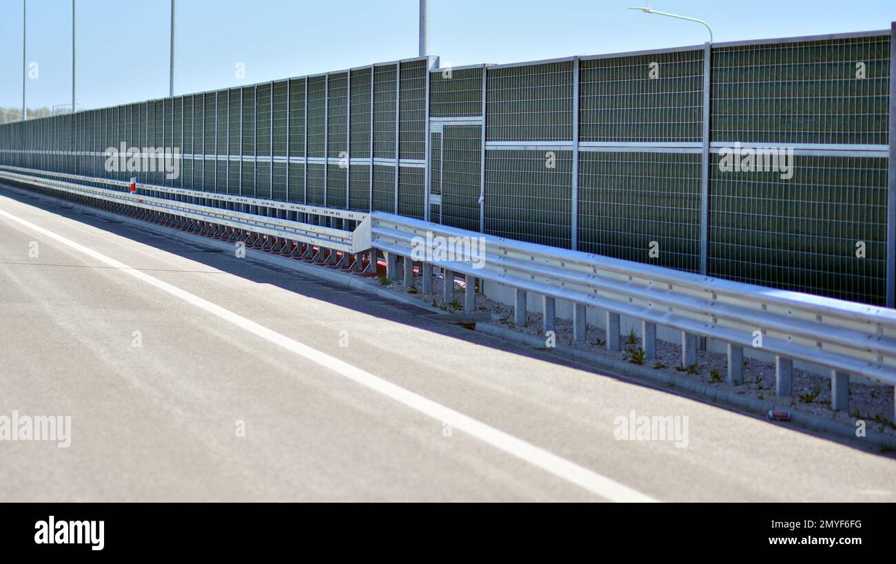 Safety barriers on the highway. Anodized safety steel barrier on ...