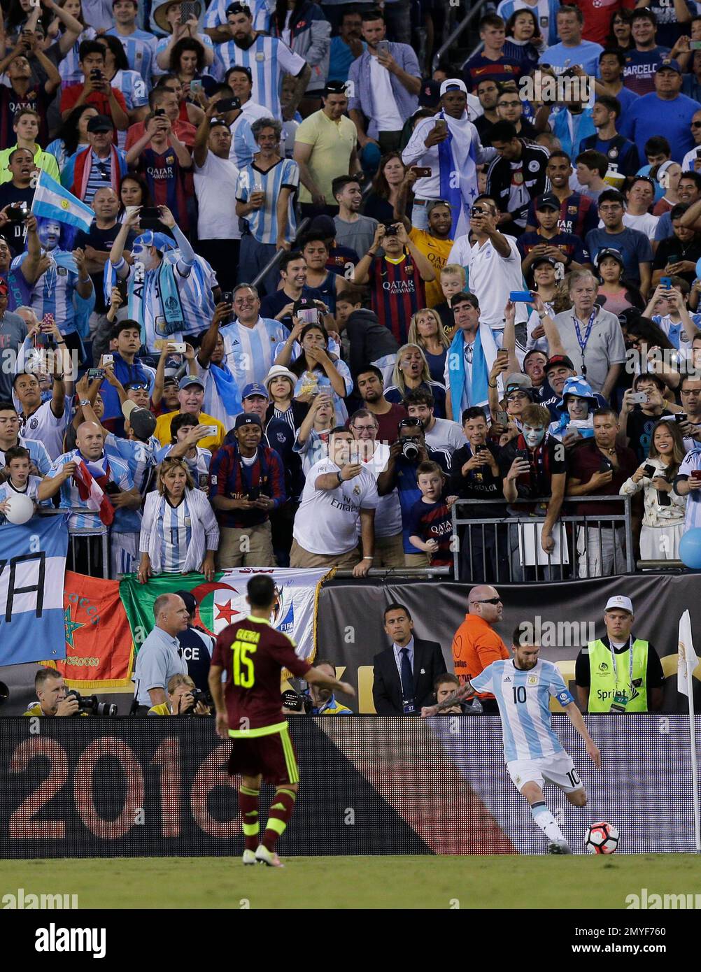 Argentina's Lionel Messi (10) takes a corner kick against Venezuela ...