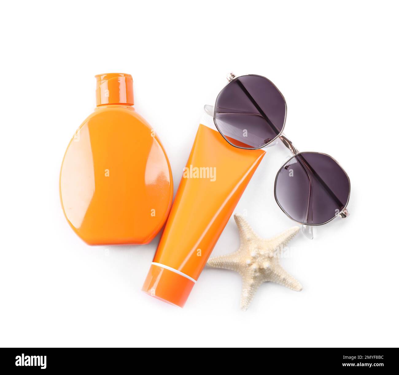 Sun protection products, sunglasses and starfish on white background ...
