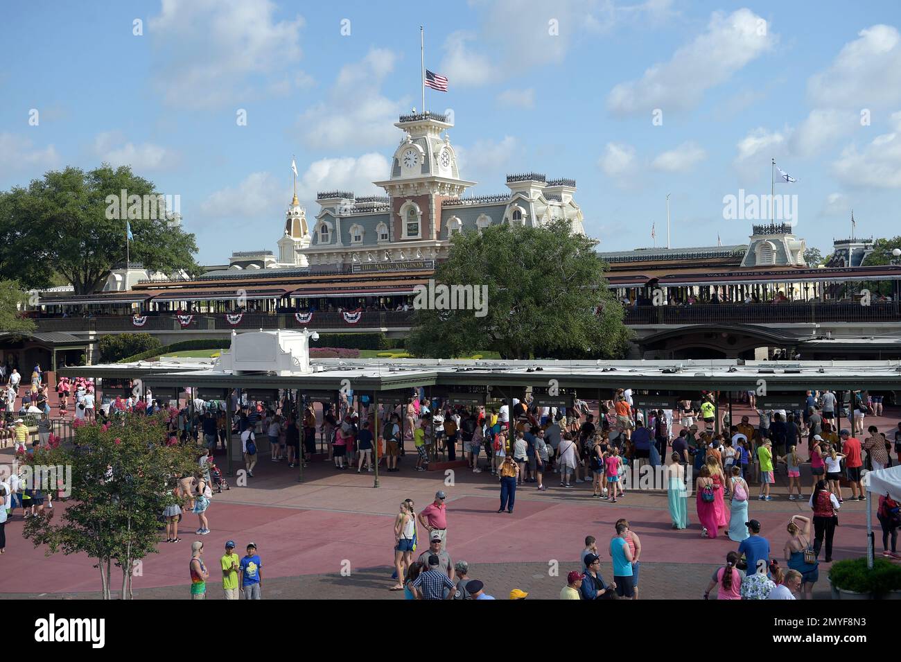 An American flag flies at half-staff in honor of the victims of the ...