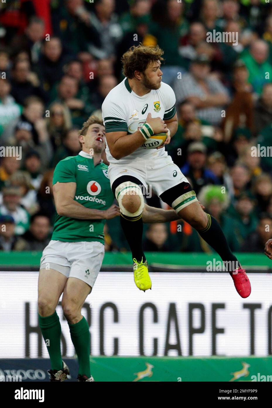 South Africa's Duane Vermeulen, right, jumps form the ball as Ireland's ...