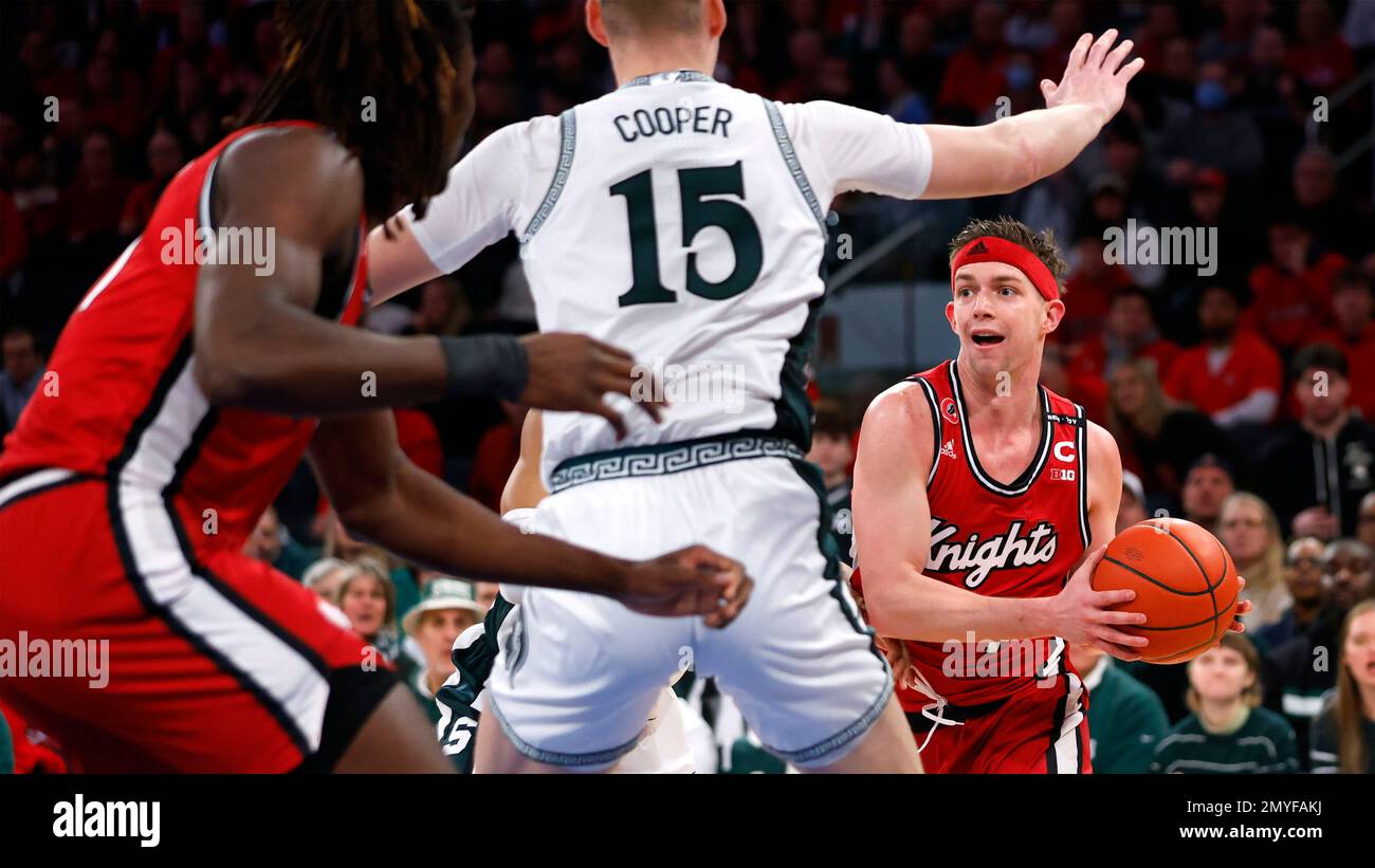 Rutgers guard Paul Mulcahy (4) drives to the basket against Michigan ...