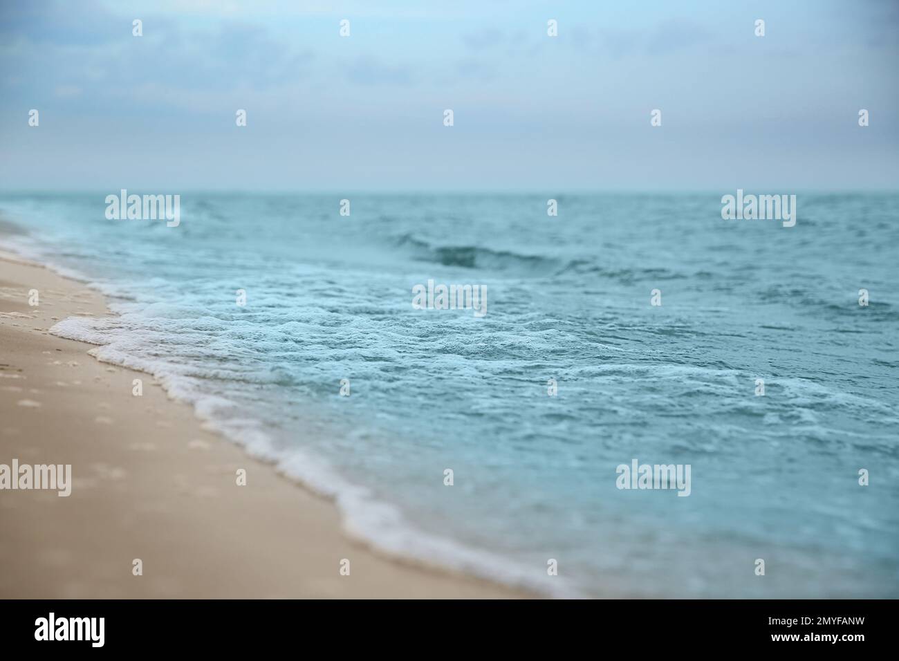 Beautiful view of sea tide on sandy beach. Summer vacation Stock Photo ...
